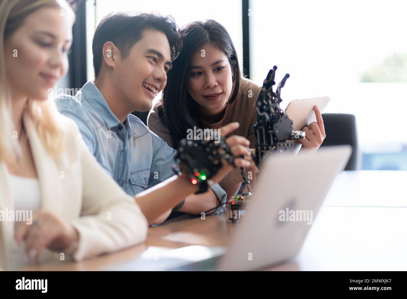 Young students researching inventions with modern technology in ...