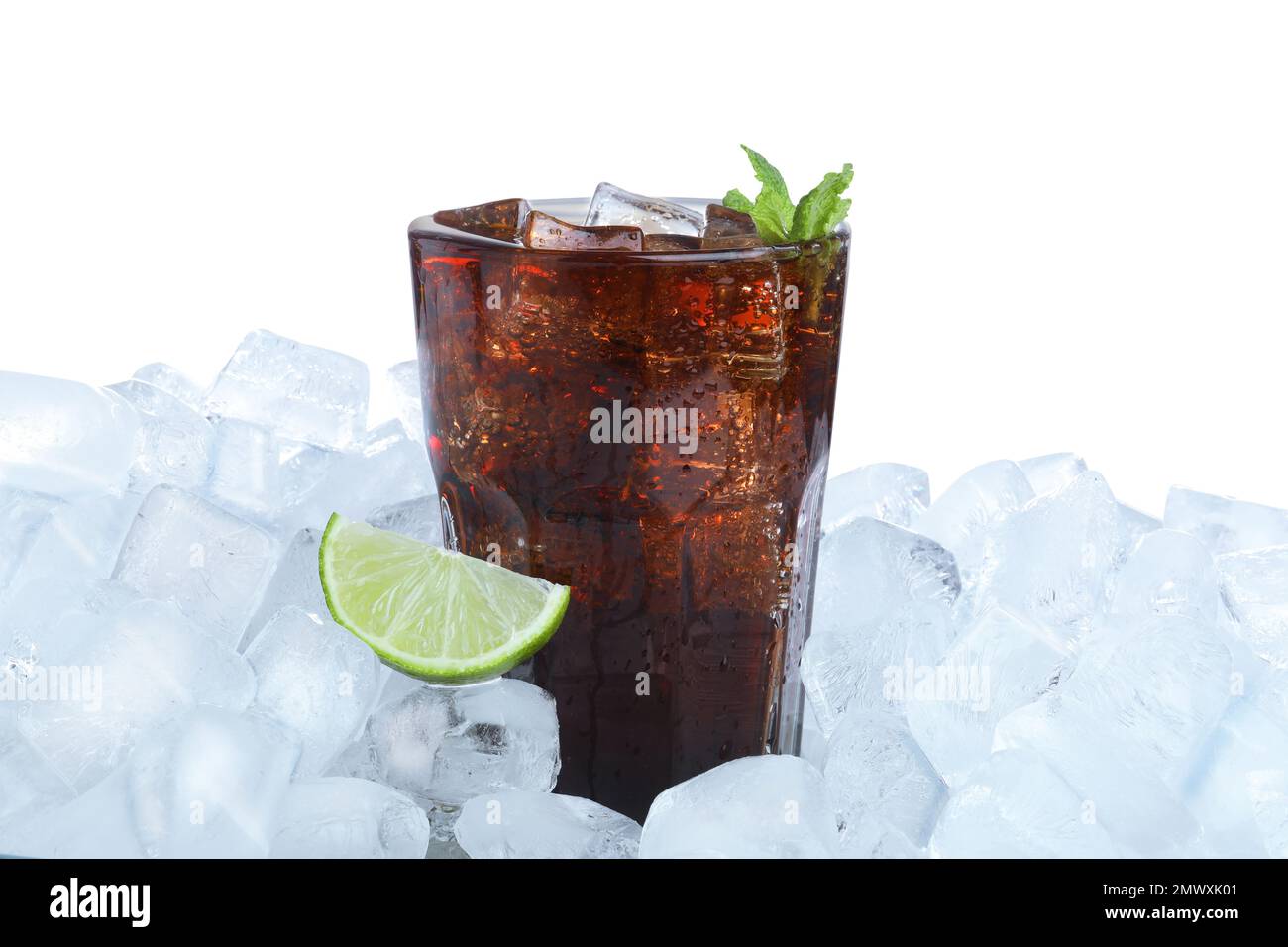 Ice cubes and delicious cocktail on white background Stock Photo - Alamy