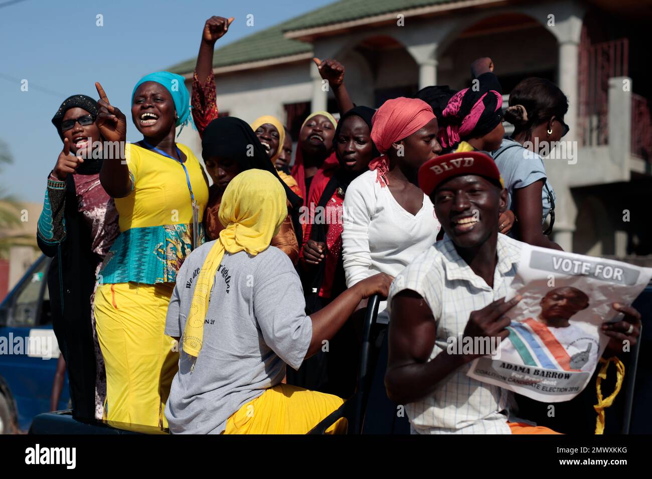 Gambians celebrate the victory of opposition coalition candidate Adama ...