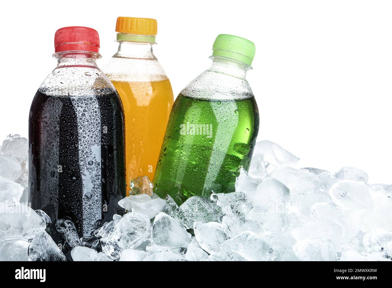 Ice cubes and different soda drinks on white background Stock Photo - Alamy