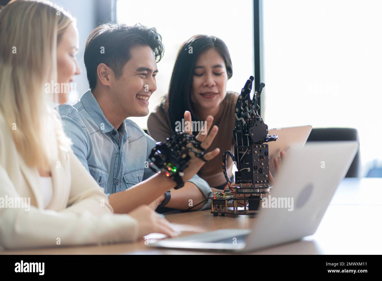 Young students researching inventions with modern technology in ...