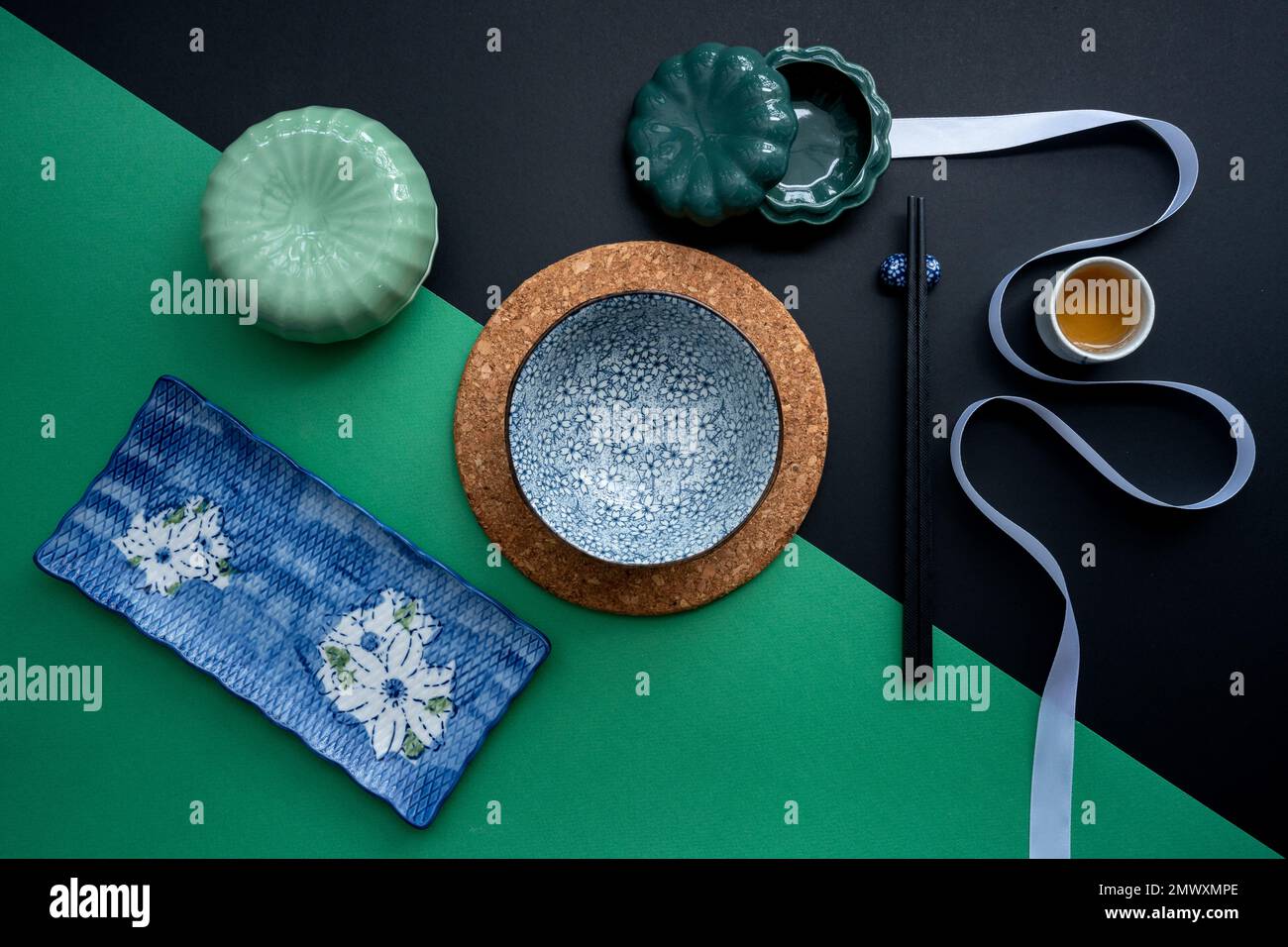 Japanese or Chinese table setting with traditional table mat and ...