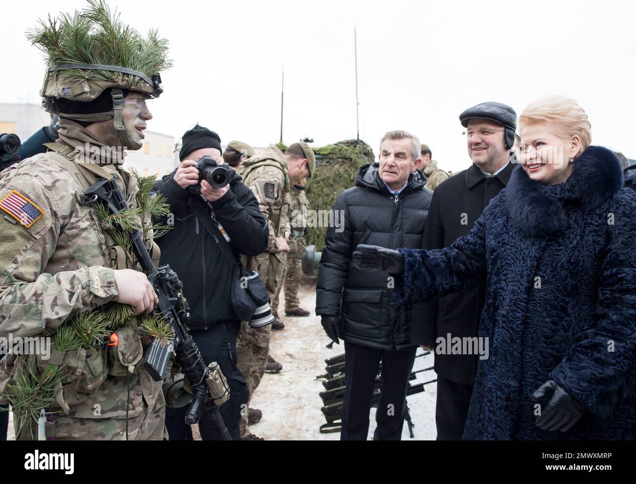 Lithuanian President Dalia Grybauskaite, right, speaks with a soldier ...