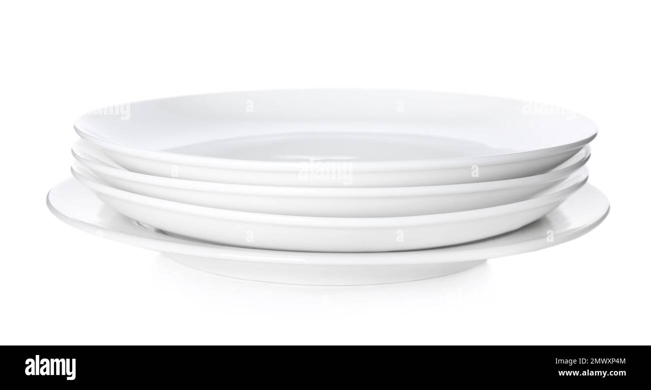 Stack of ceramic plates isolated on white Stock Photo - Alamy