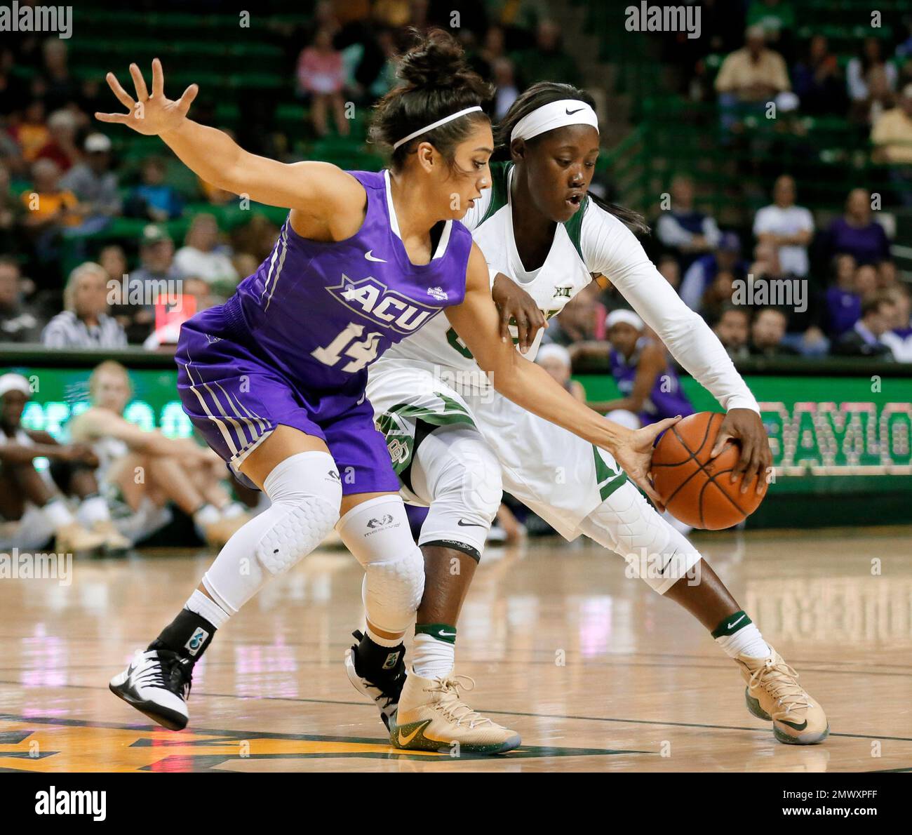 Abilene Christian guard Pamela Herrera, left, attempts a steal against ...