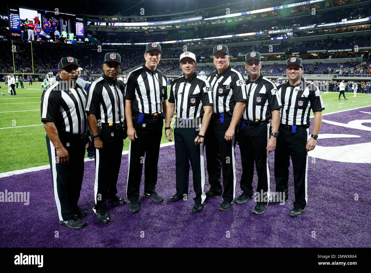 Officials, from left, field judge Buddy Horton, head linesman Patrick ...