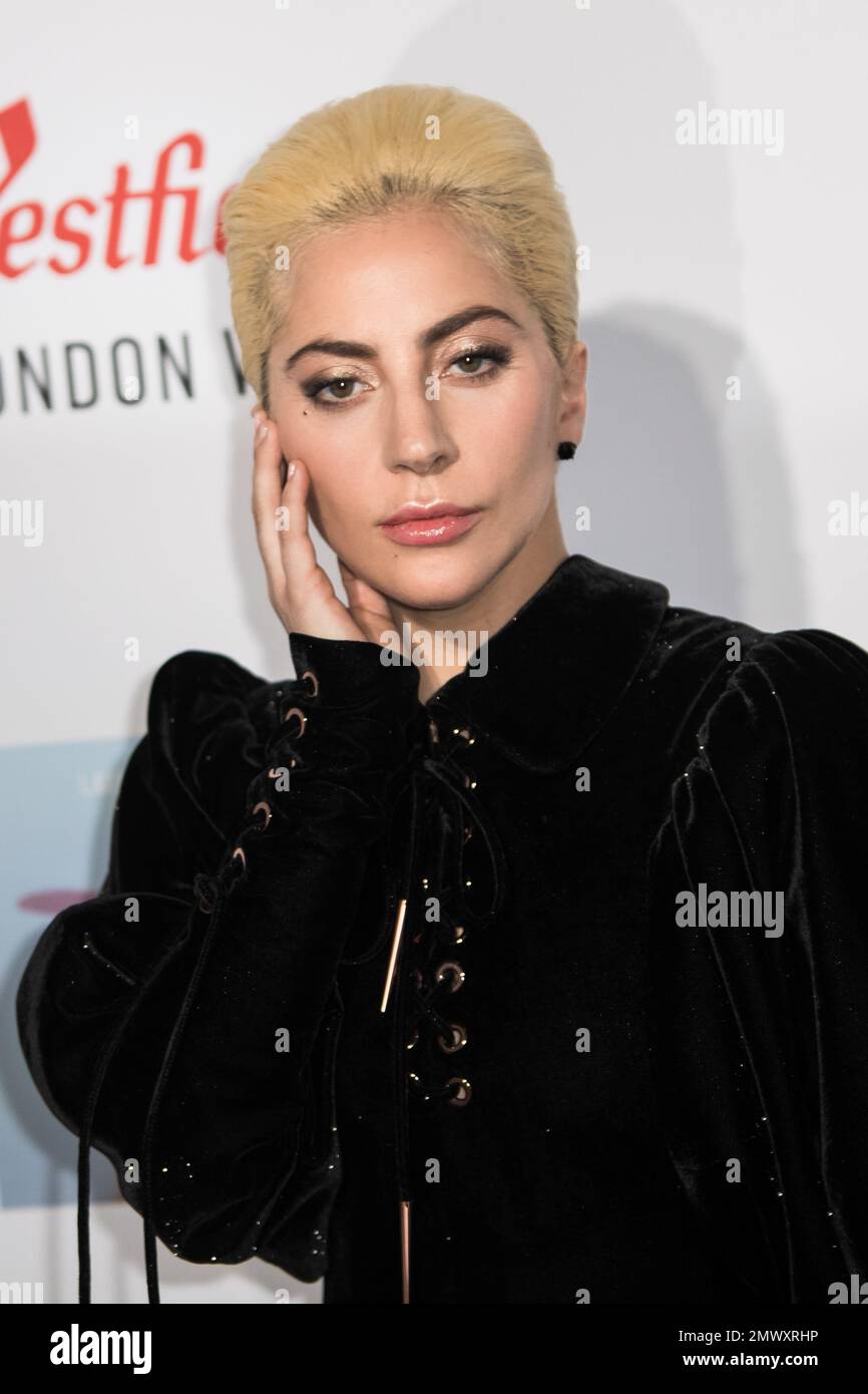 Singer Lady Gaga poses for photographers during a photo call before her ...