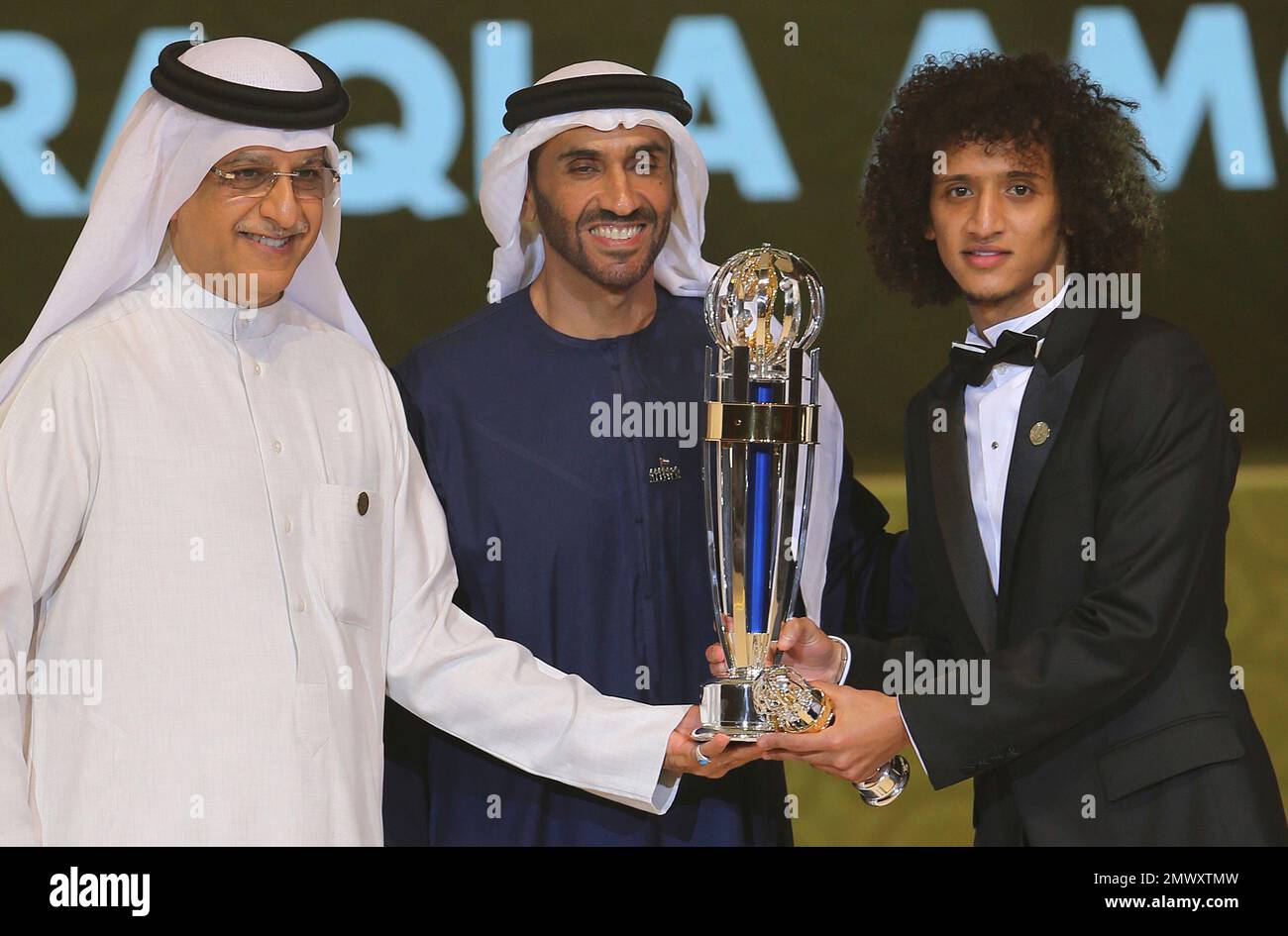 Emirati football player Omar Abdulrahman, right, receives the AFC ...