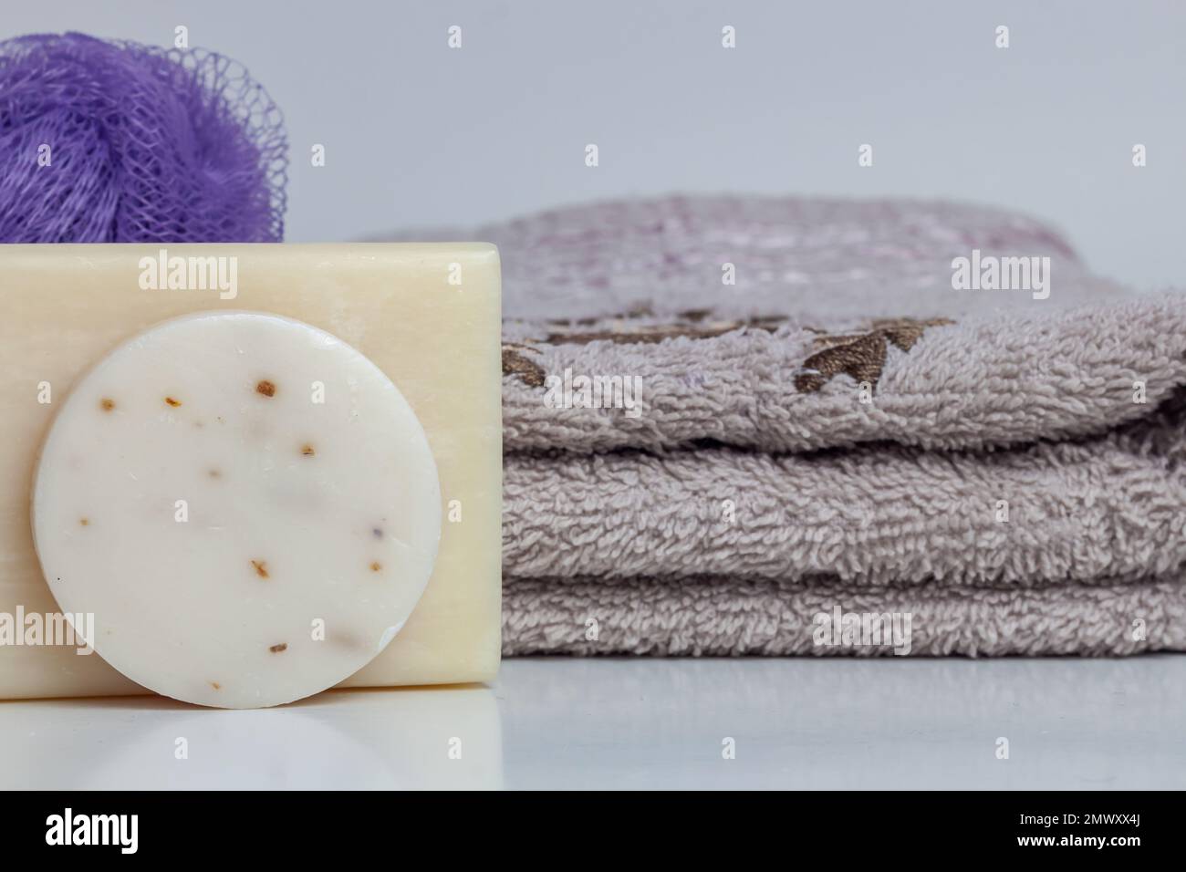 Clean towel with natural handmade soap on white background Stock Photo ...