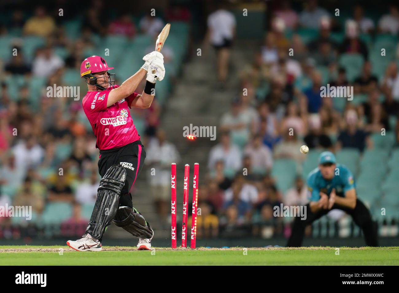 Dan Christian of the Sixers is bowled out by Spencer Johnson of the ...