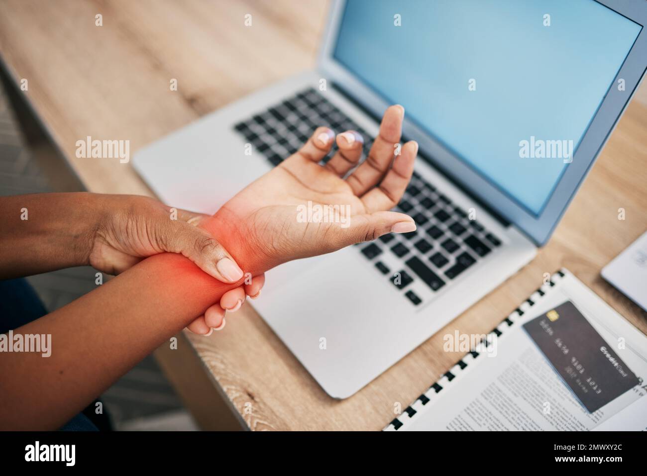 Pain, working and wrist of black woman with laptop and injury, joint ...