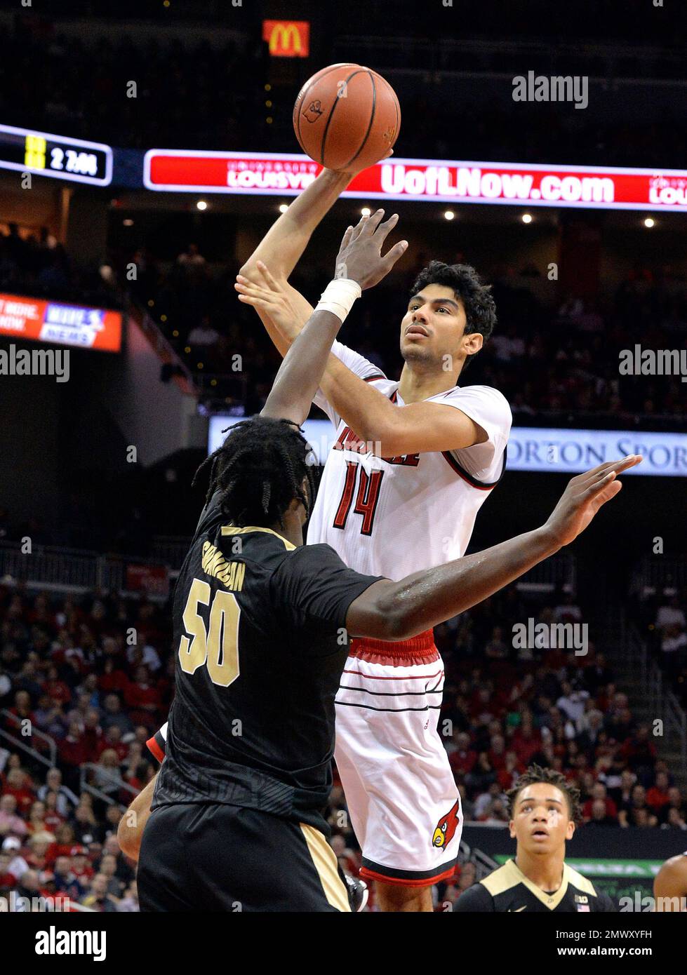 Louisville's Anas Mahmoud (14) shoots over Purdue's Caleb Swanigan (50 ...