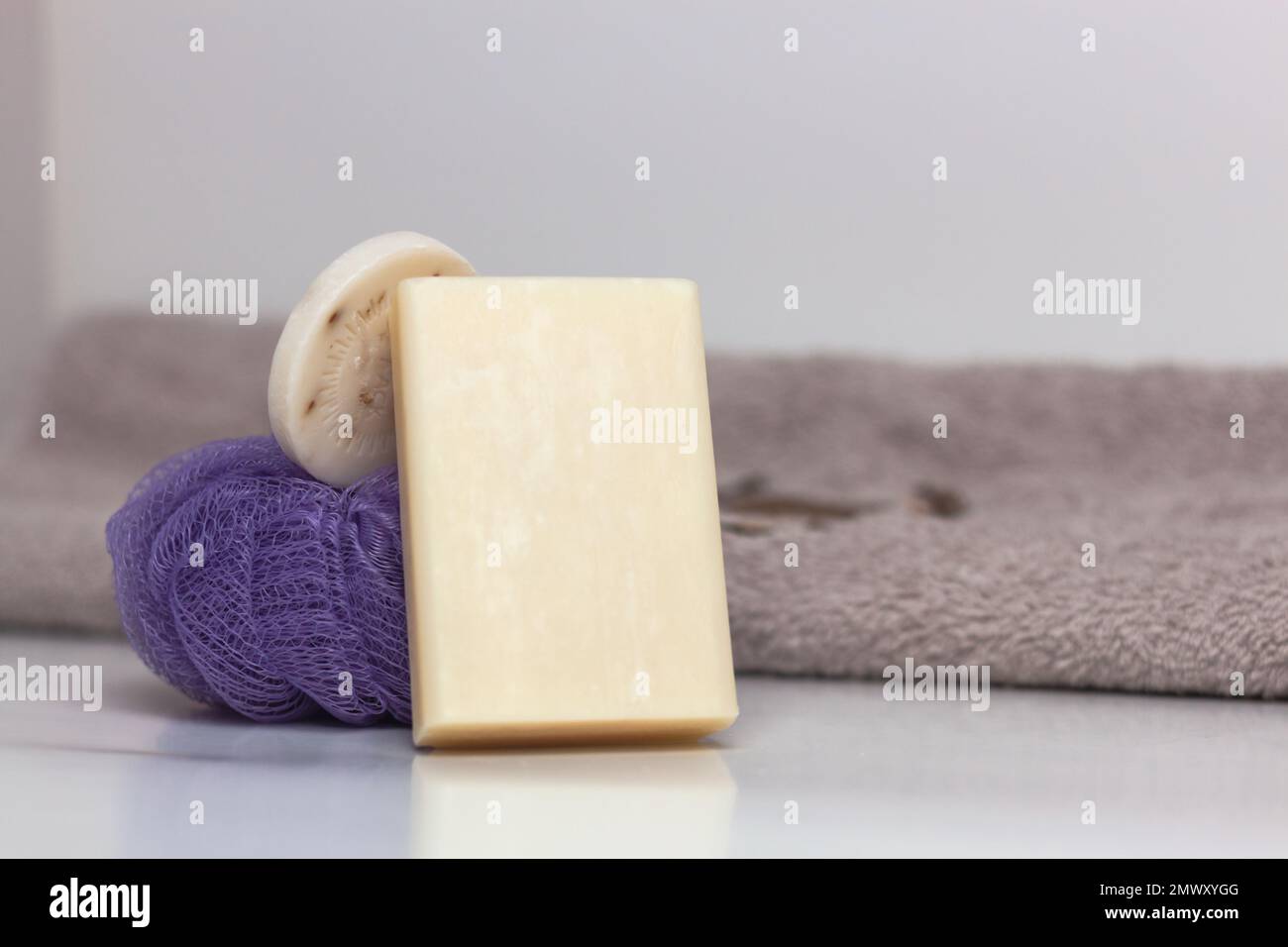 Clean towel with natural handmade soap on white background Stock Photo ...