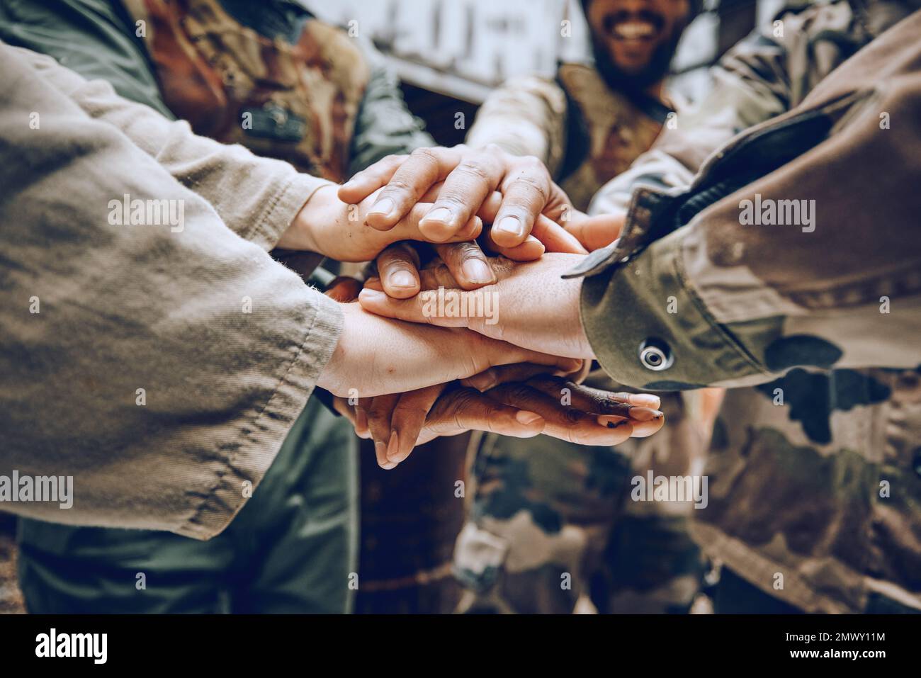 Soldier, team building or hands in a huddle for a mission, strategy or ...