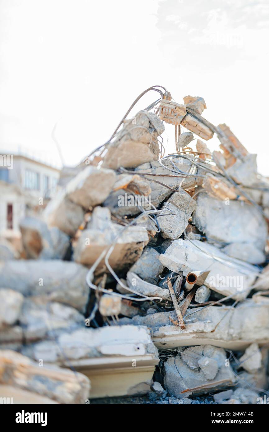 Construction debris waste multiple stones, wires, metal parts of a ...