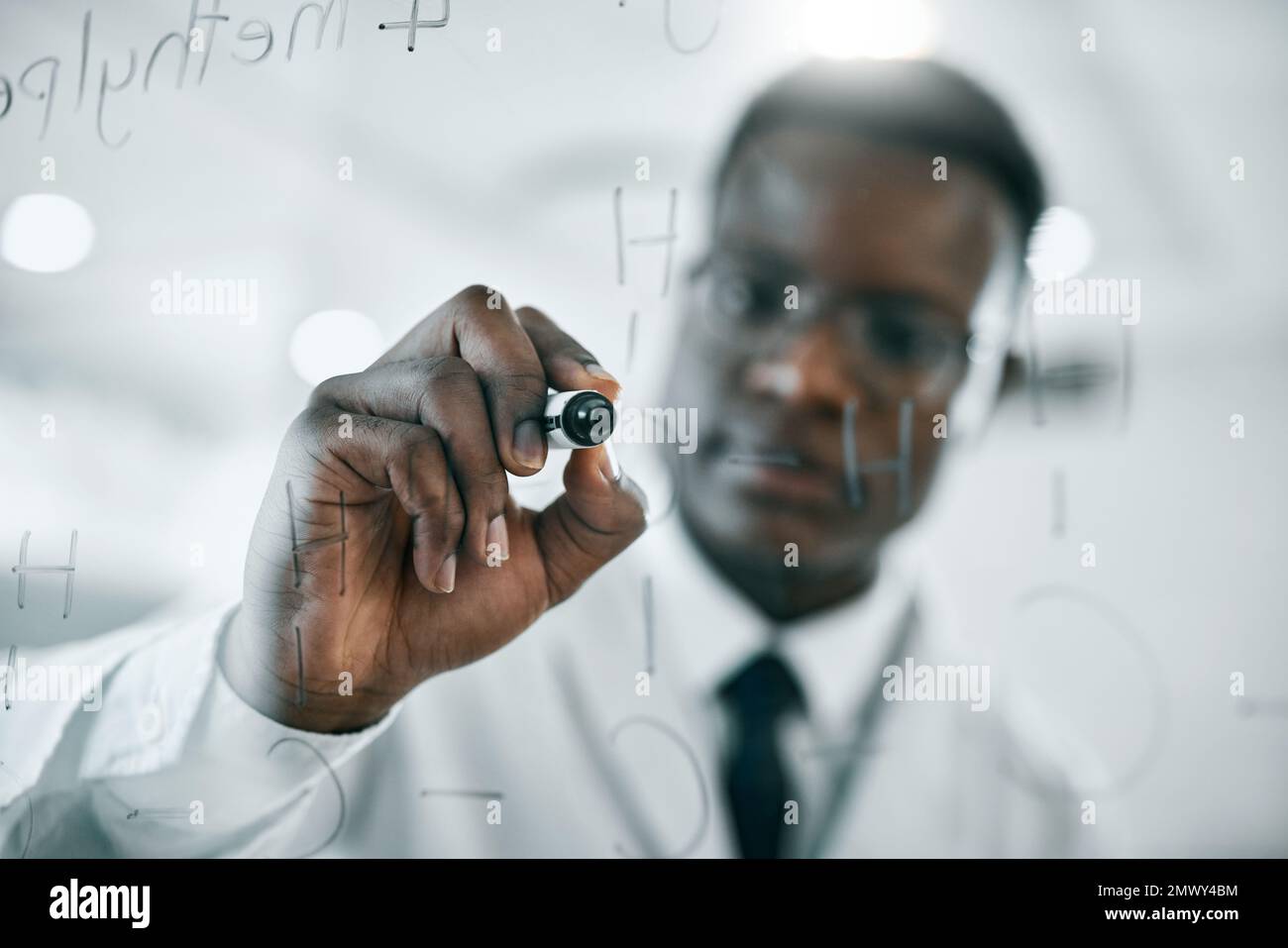 Science research, planning and black man scientist writing on glass ...