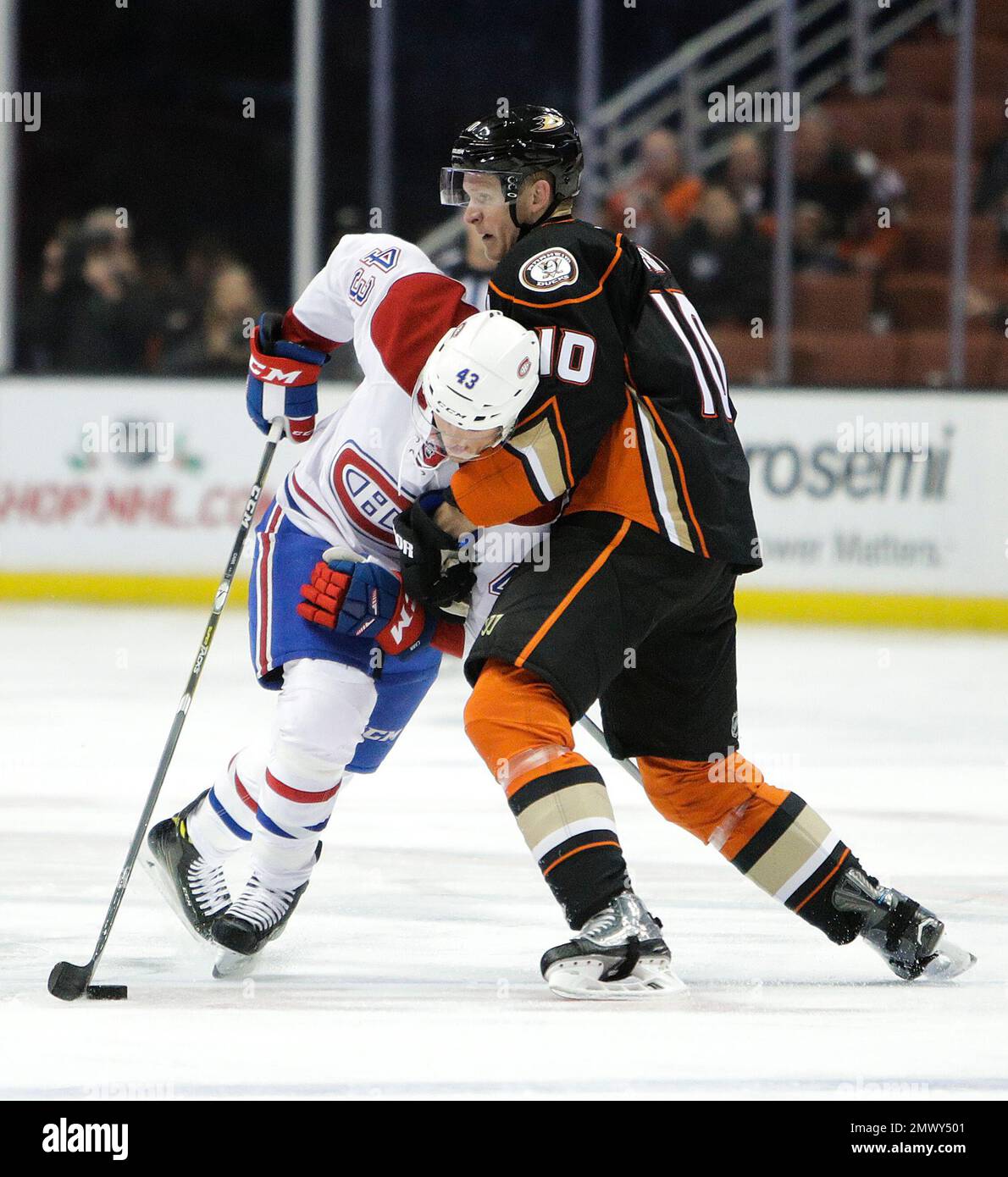 Montreal Canadiens' Daniel Carr, left, is checked by Anaheim Ducks ...