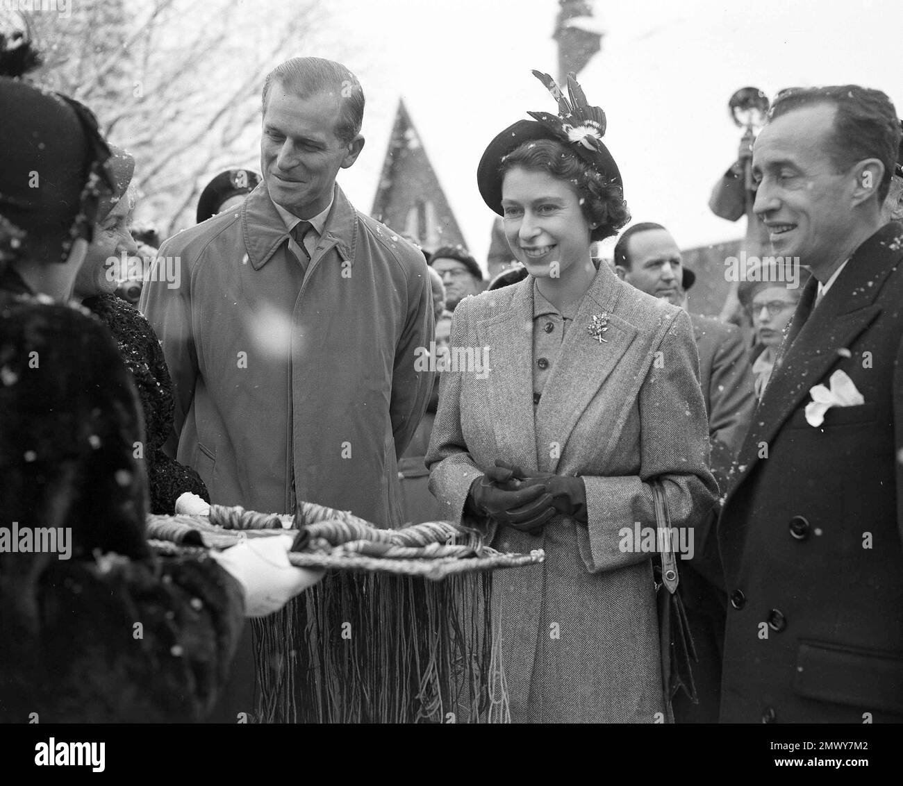 Princess Elizabeth and Prince Philip are presented with sashes worn by ...