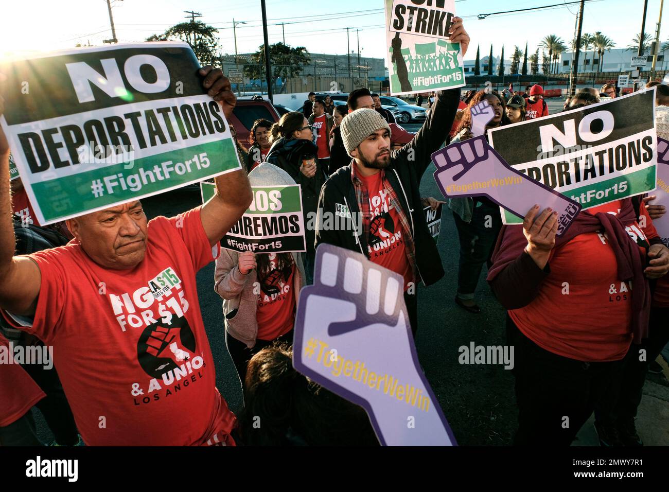 Protesters carrying signs and chanting slogans march during a protest ...
