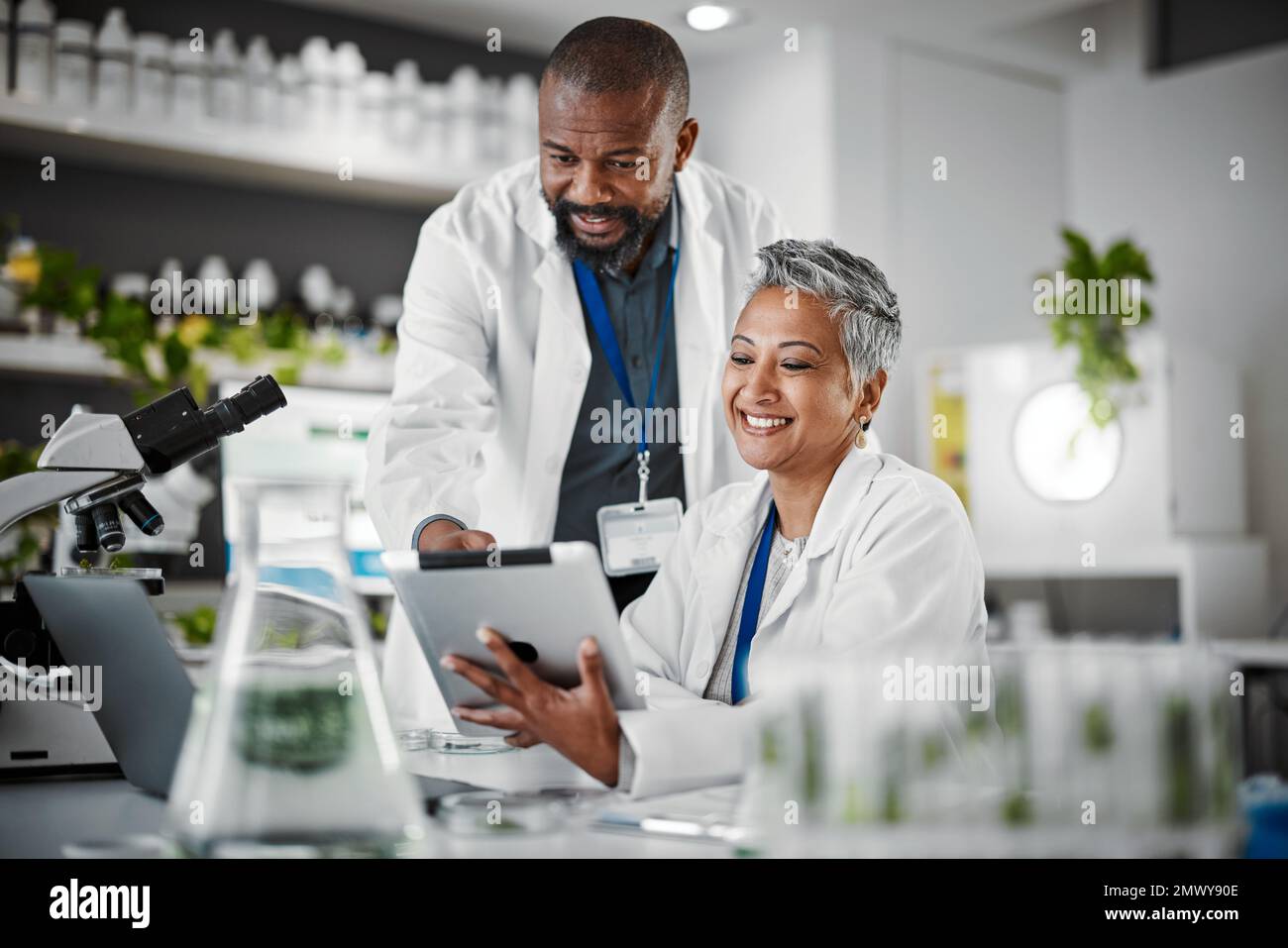 Teamwork, people or tablet in biology laboratory, science collaboration ...
