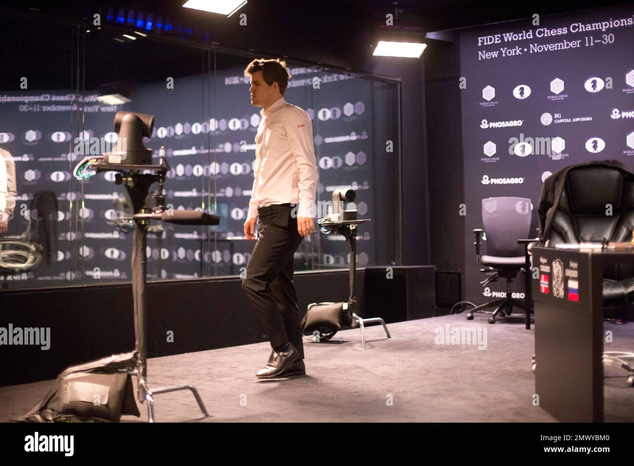 Magnus Carlsen, of Norway, steps away from the table during Game 12 of ...