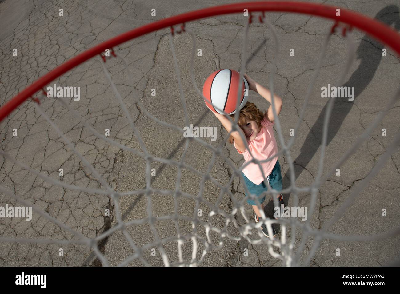 Cute smiling boy plays with basket ball. Cute little boy child in ...