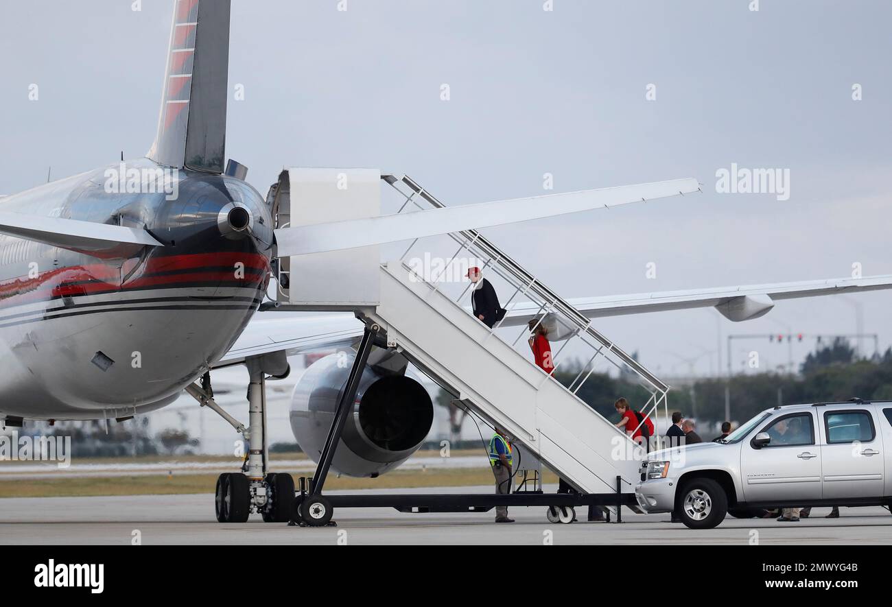 President-elect Donald Trump, followed by his wife Melania Trump and ...