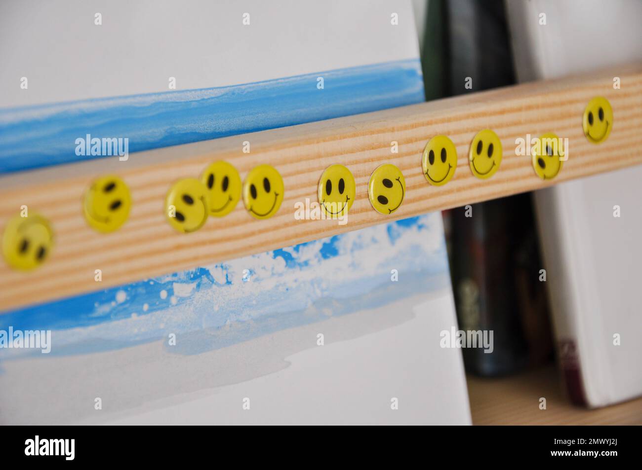 Smiley face stickers on a wooden bookcase, toddler room, happy stickers ...