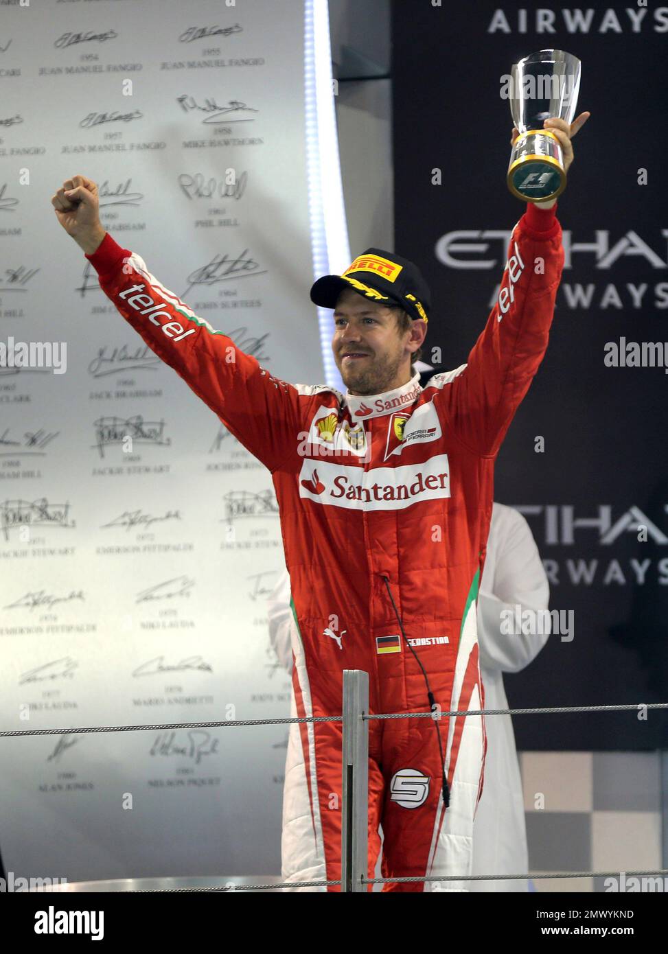 Ferrari driver Sebastian Vettel of Germany holds his trophy up during ...