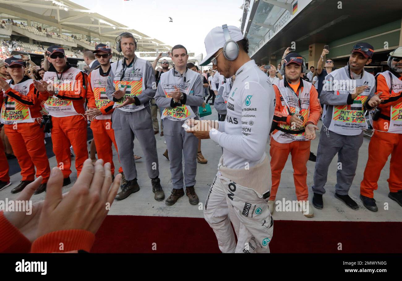 Mercedes driver Lewis Hamilton of Britain walks in the pits prior to ...