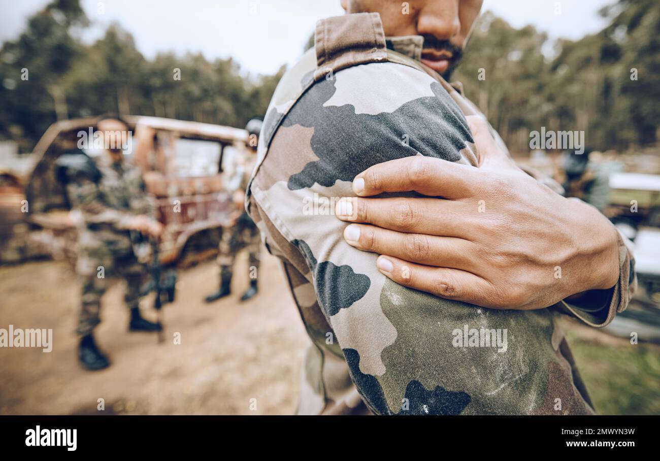 Injury, paintball and arm pain by man on field for team sport, fitness ...