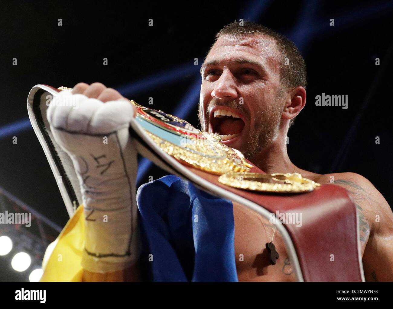 Vasyl Lomachenko, of Ukraine, celebrates after defeating Nicholas ...