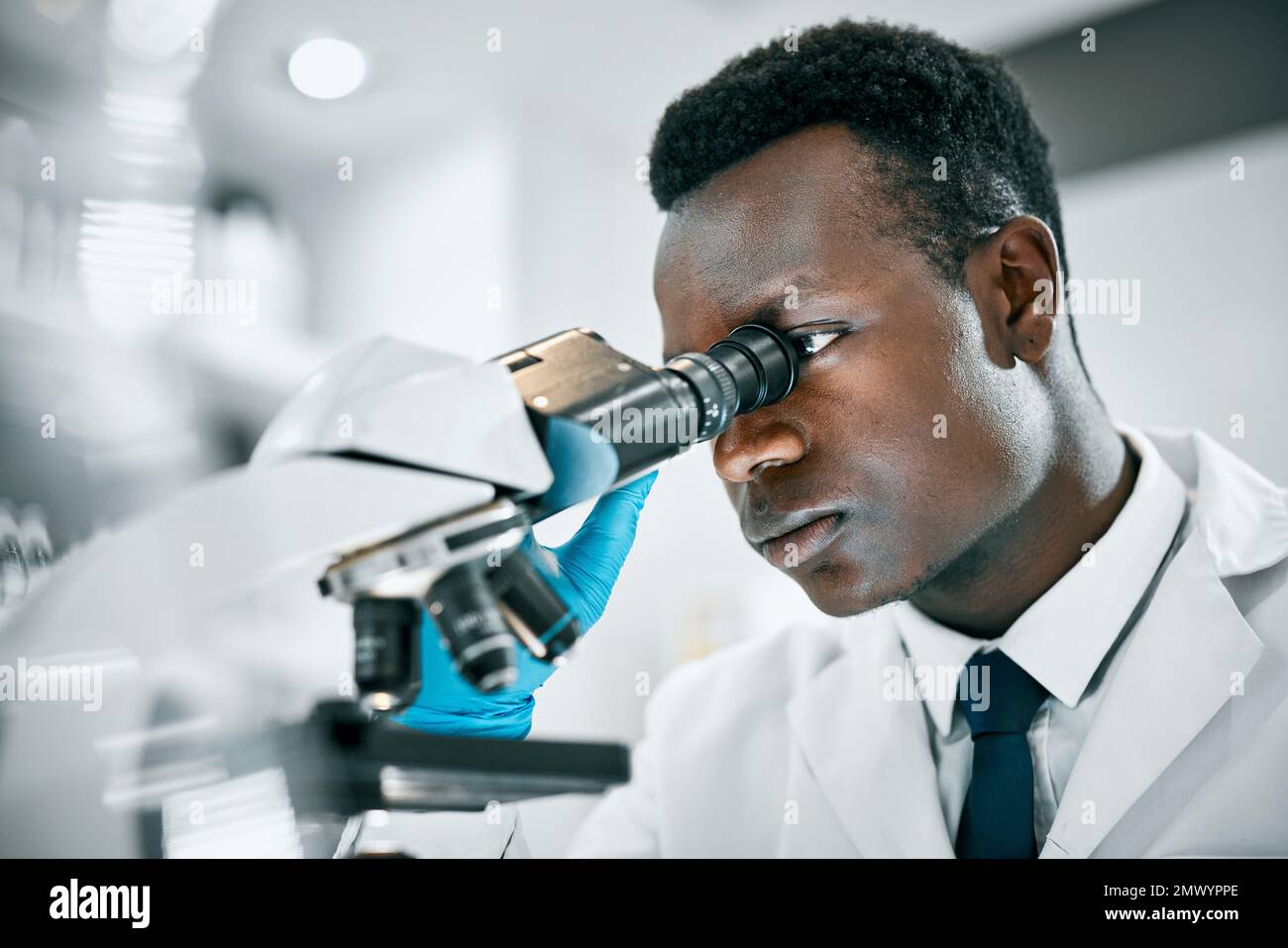 Doctor, microscope or black man in science laboratory for DNA research ...