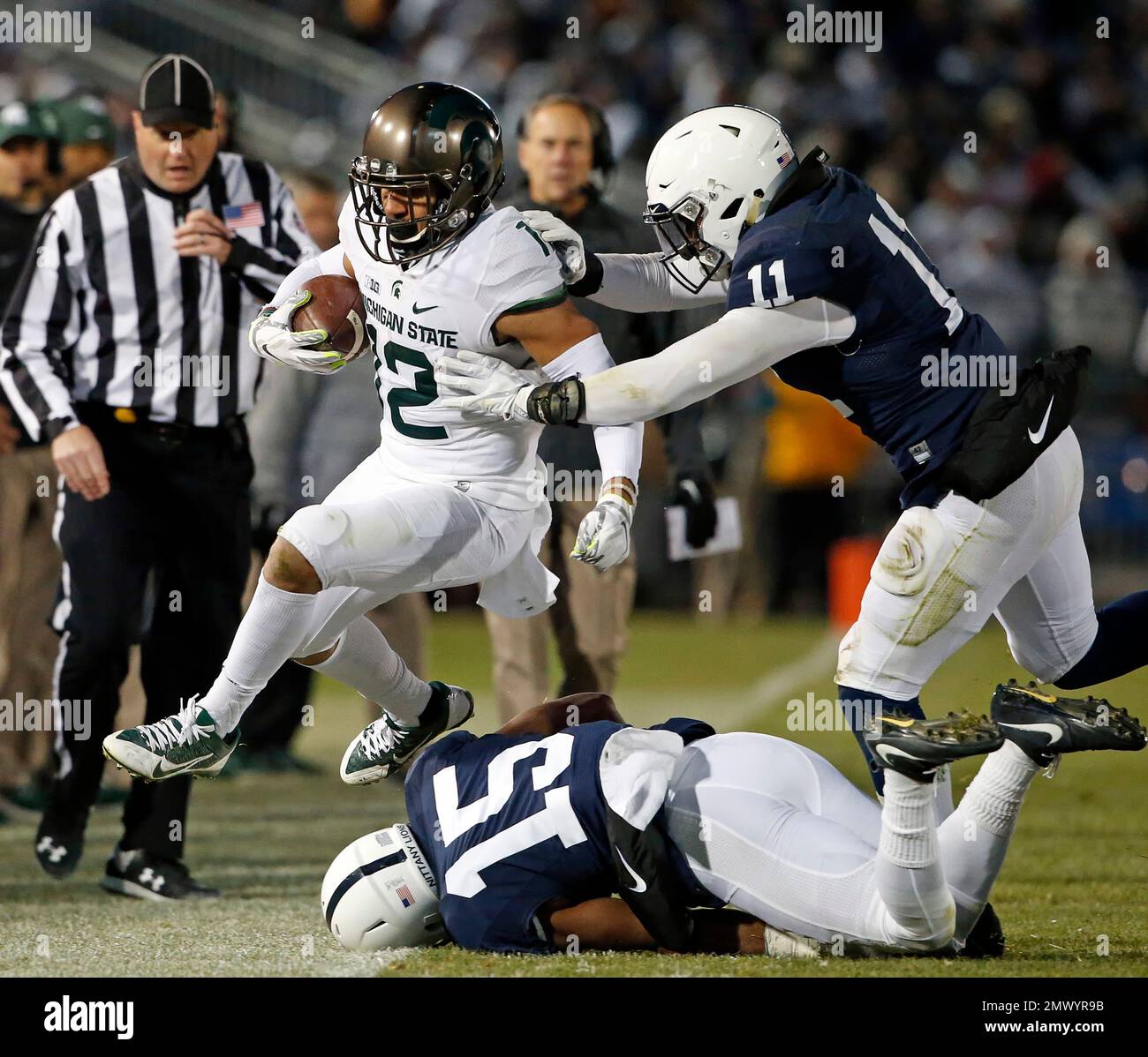 Michigan State's R.J. Shelton (12) gets pushed out of bounds after a ...