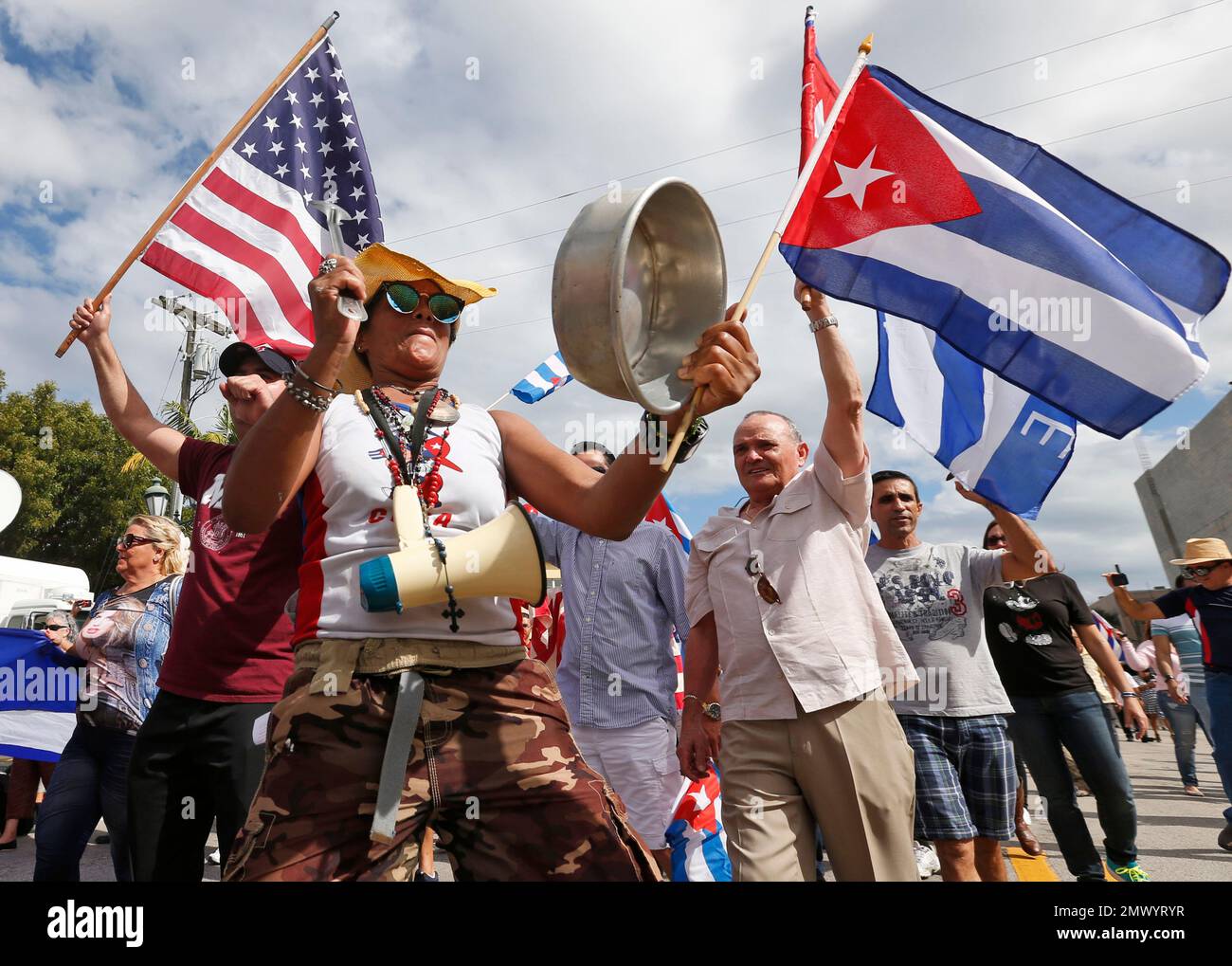 Banging pots and pans and waving Cuban and American flags, members of ...