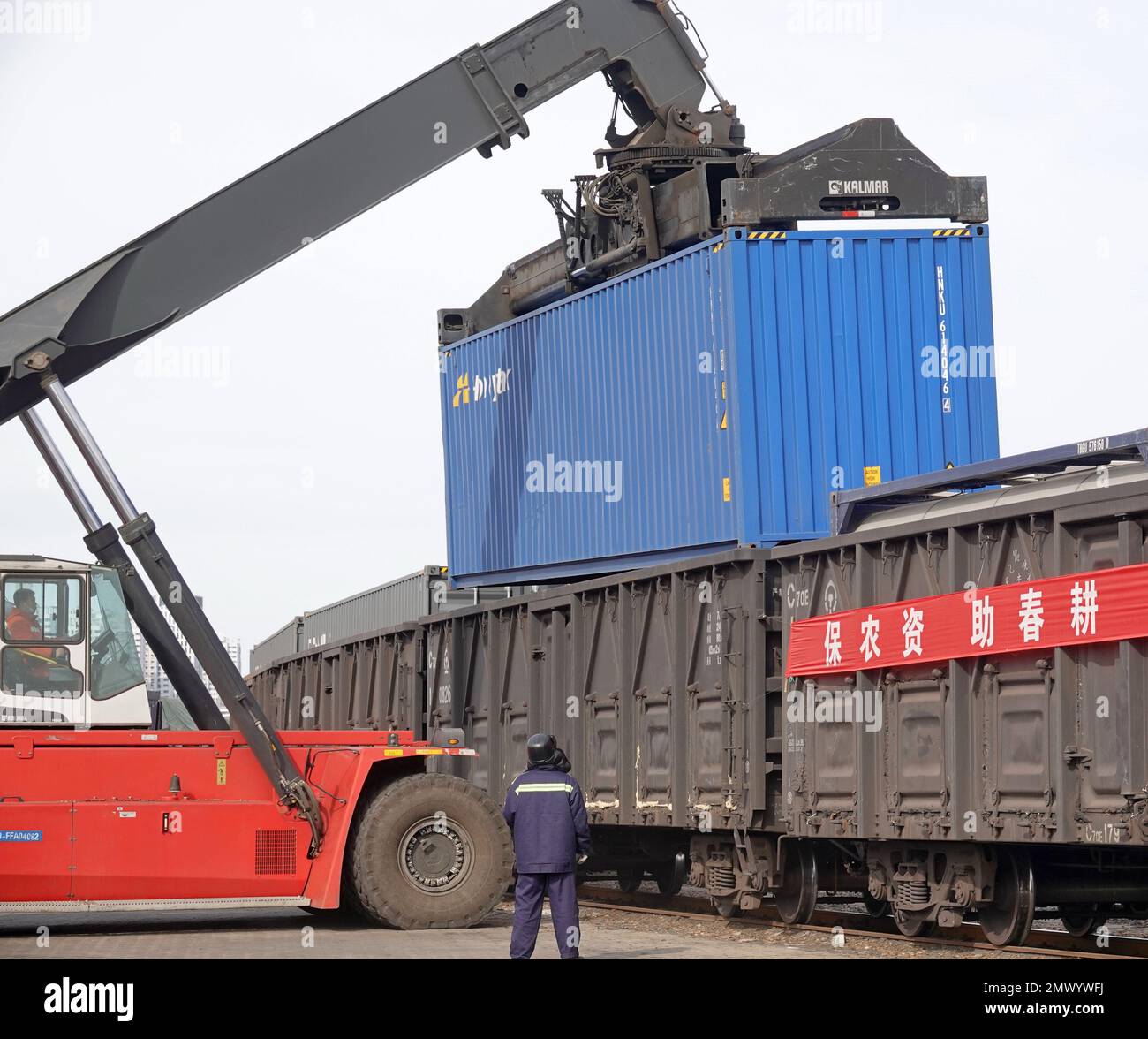 YANTAI, CHINA - FEBRUARY 2, 2023 - Cranes unload containers of potash ...