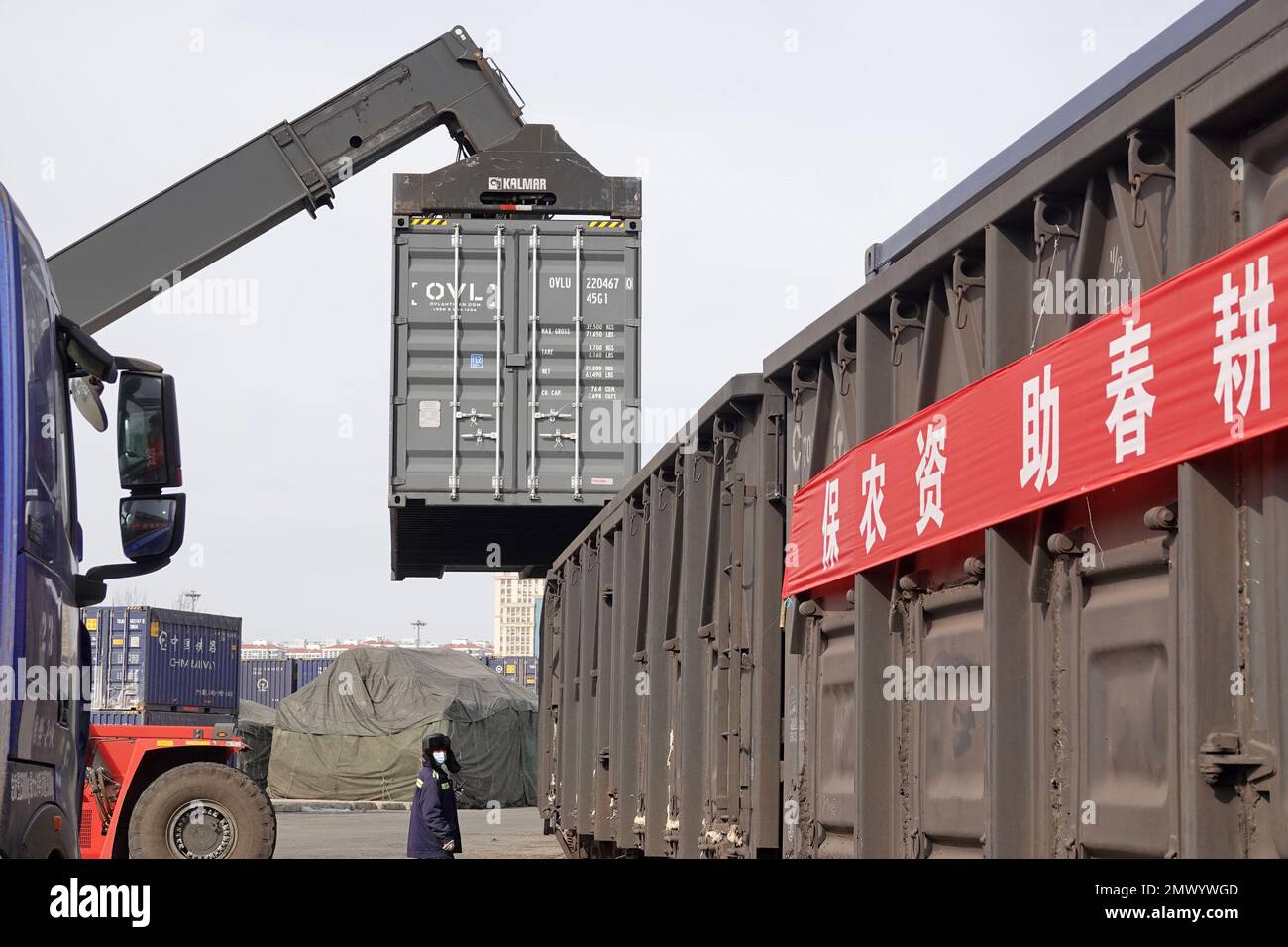 YANTAI, CHINA - FEBRUARY 2, 2023 - Cranes unload containers of potash ...