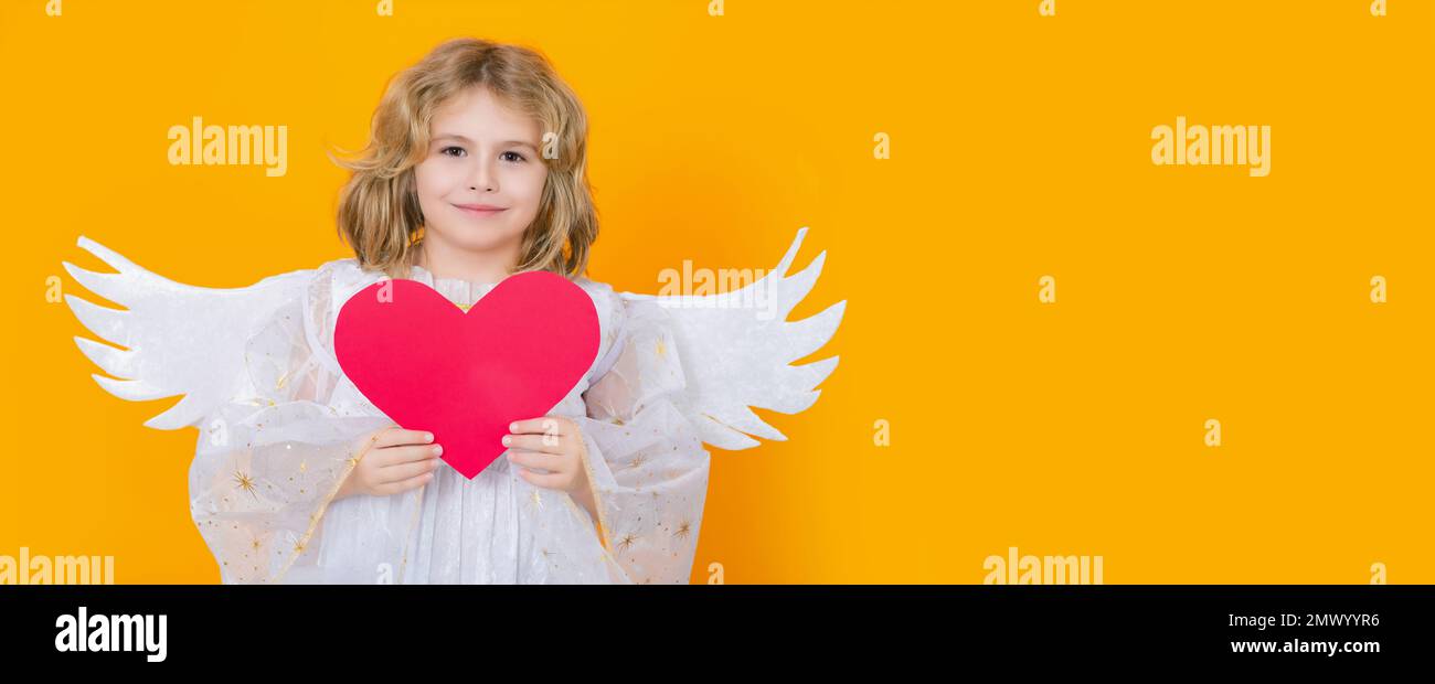 Angel with heart. Beautiful little angel. Isolated studio shot. Cute ...