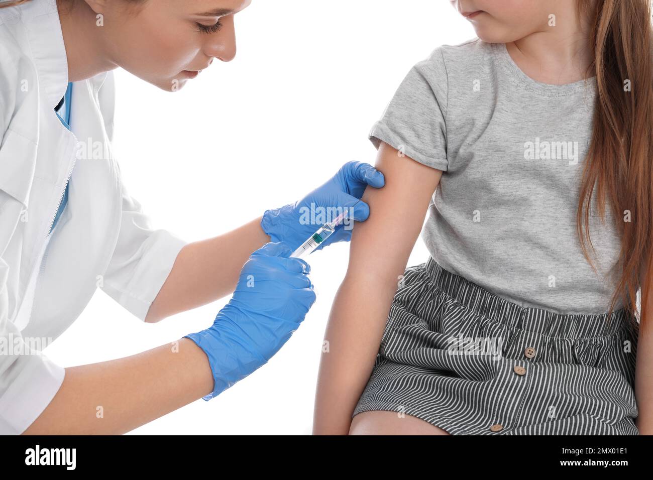 Little girl receiving chickenpox vaccination on white background ...