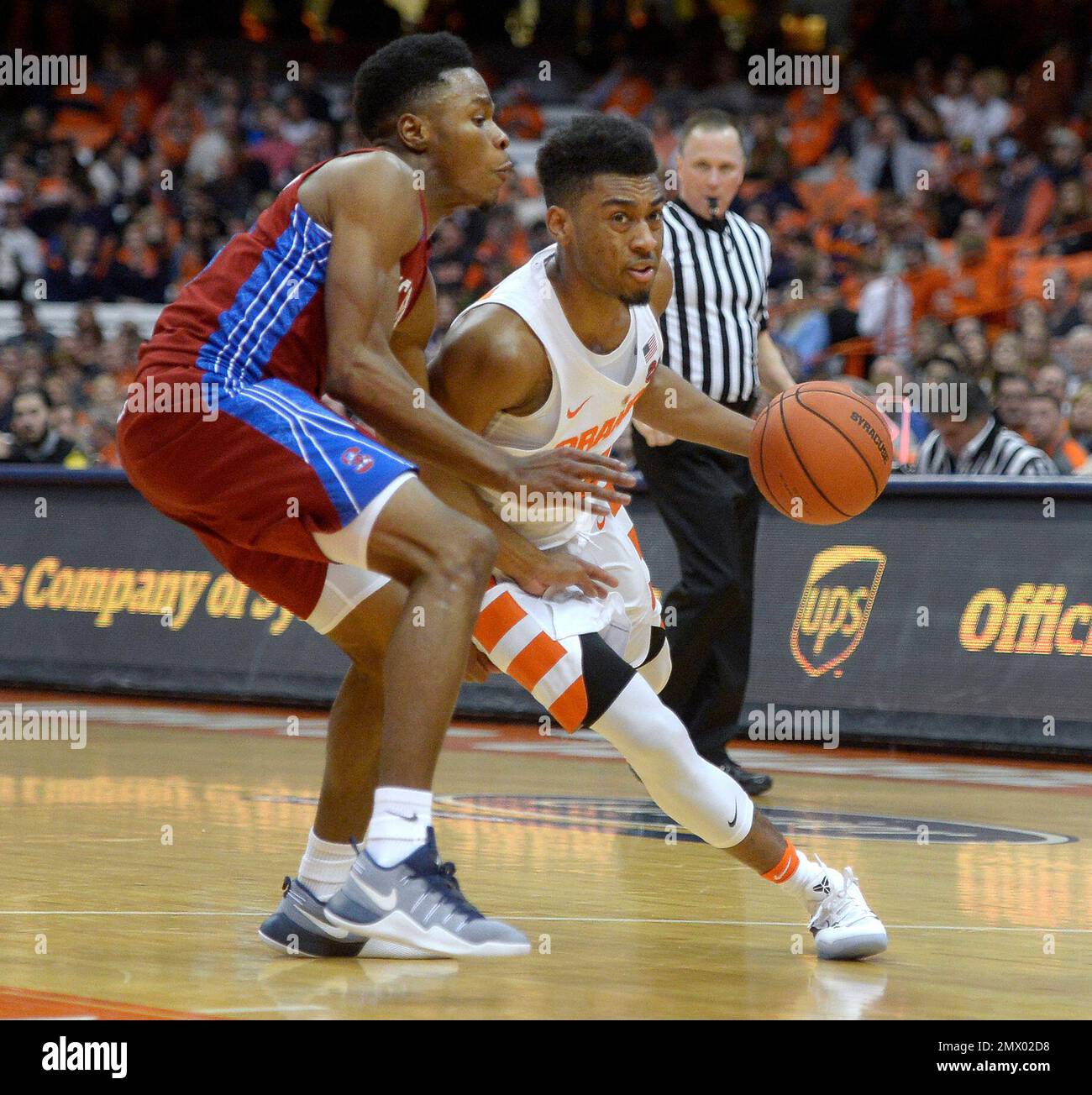 Syracuse’s John Gillon, right, drives past South Carolina State’s James ...