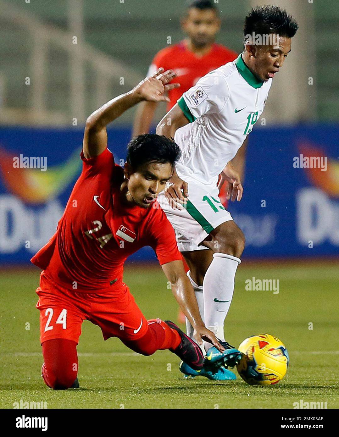 Singapore's Muhammad Yasir Hanapi, left, and Indonesia's Bayu Pradana ...