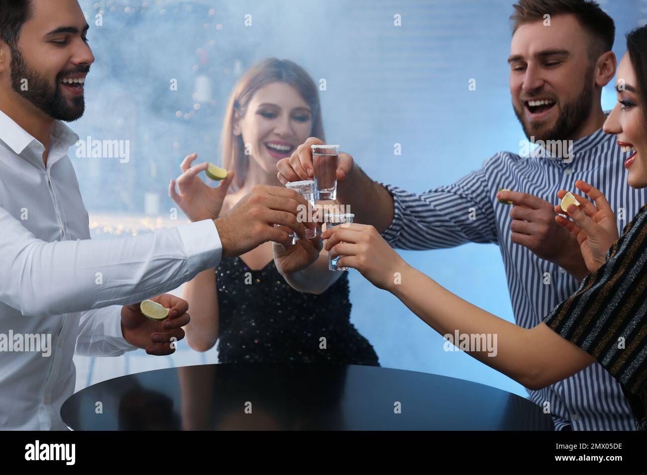 Hands toasting shots hi-res stock photography and images - Alamy