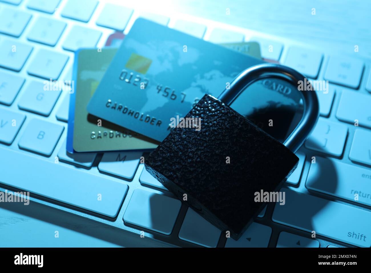Credit cards, lock and computer keyboard on table, closeup. Cyber crime ...