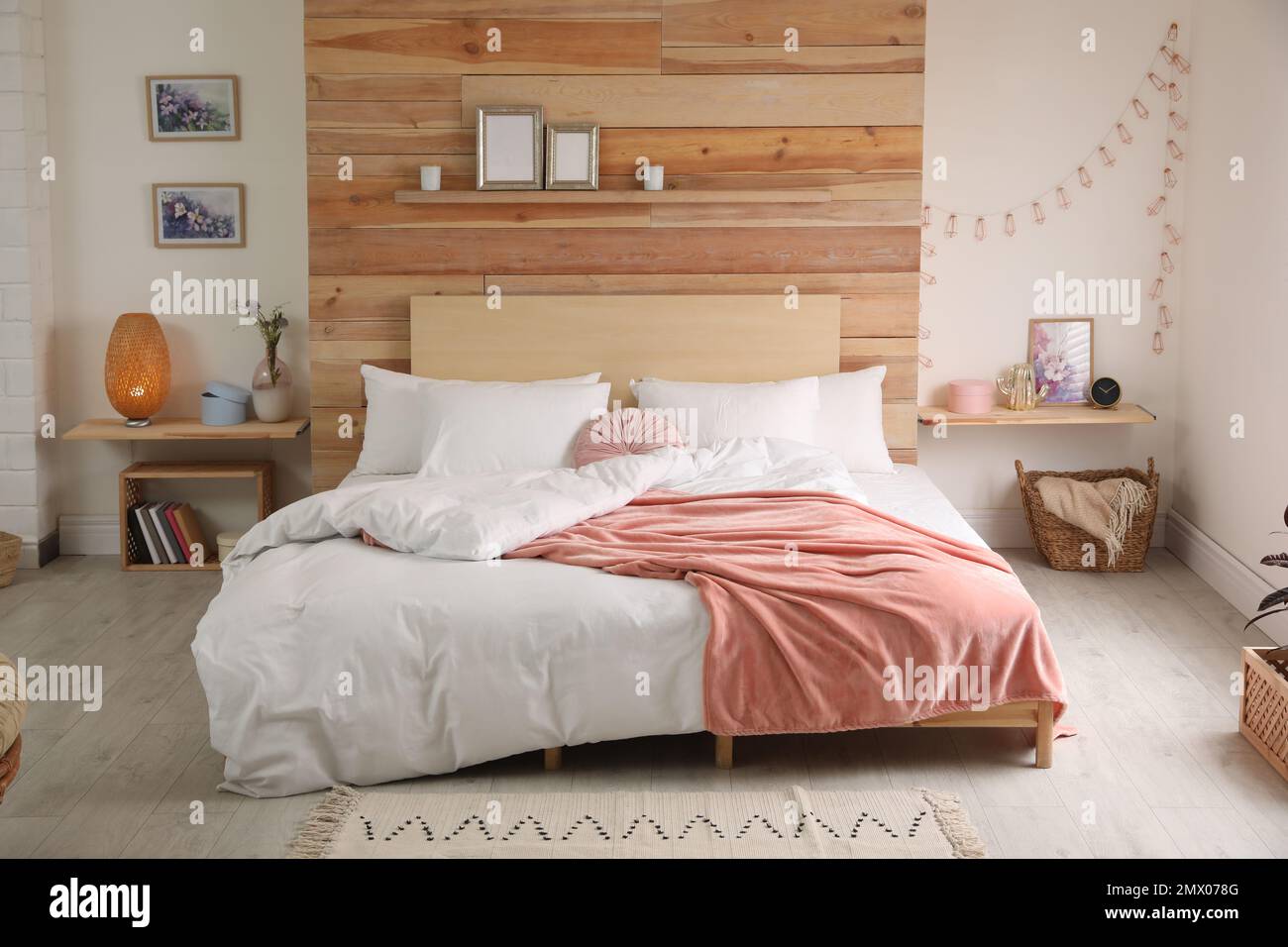 Stylish room interior with big comfortable bed Stock Photo - Alamy