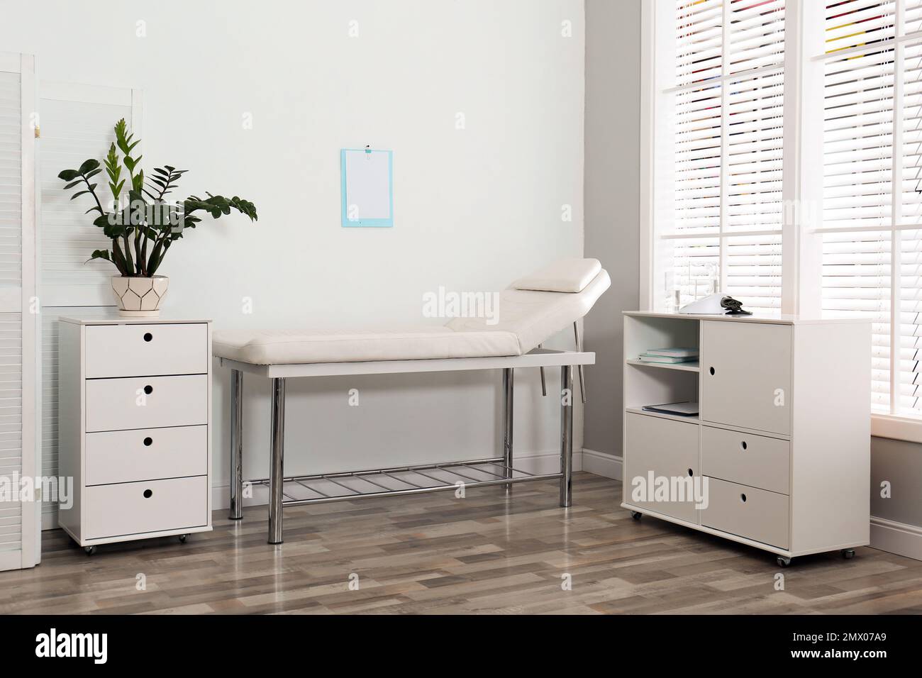 Modern medical office interior with examination table Stock Photo - Alamy