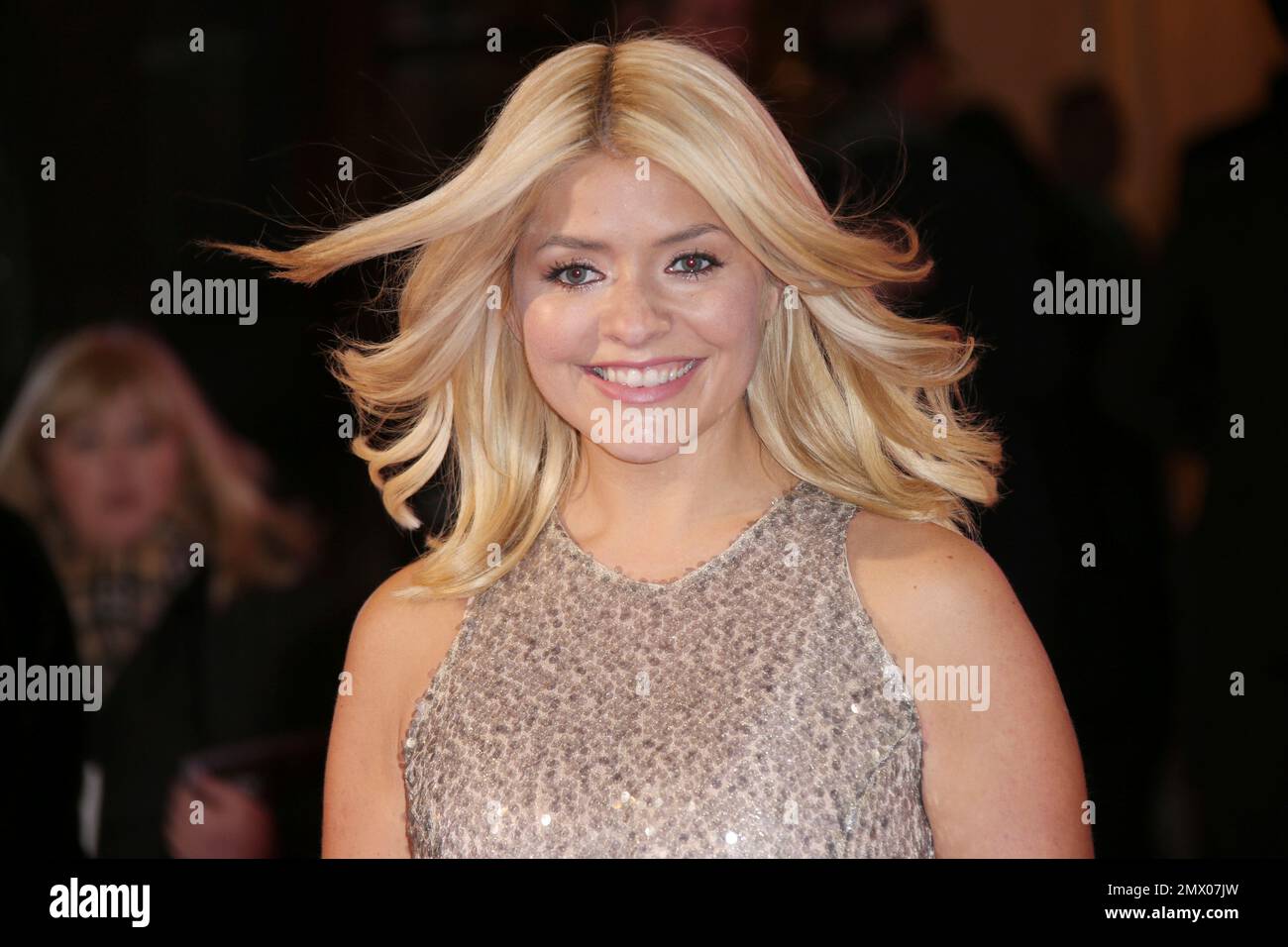 Presenter Holly Willoughby poses for photographers upon arrival at the ...