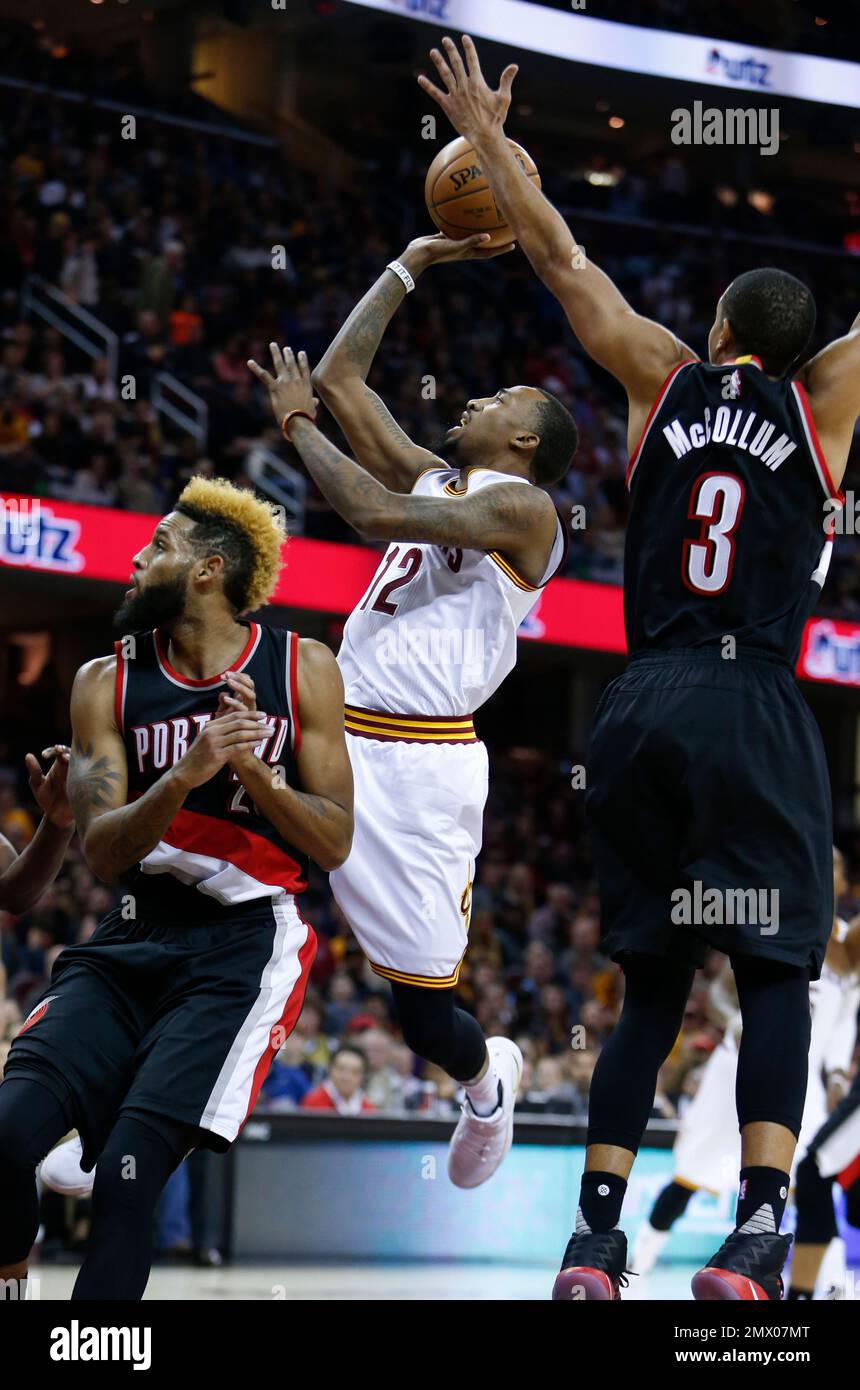 Cleveland Cavaliers' Jordan McRae (12) puts up a shot between Portland ...