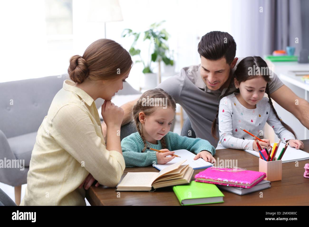 Children doing drawing work parents hi-res stock photography and images - Alamy