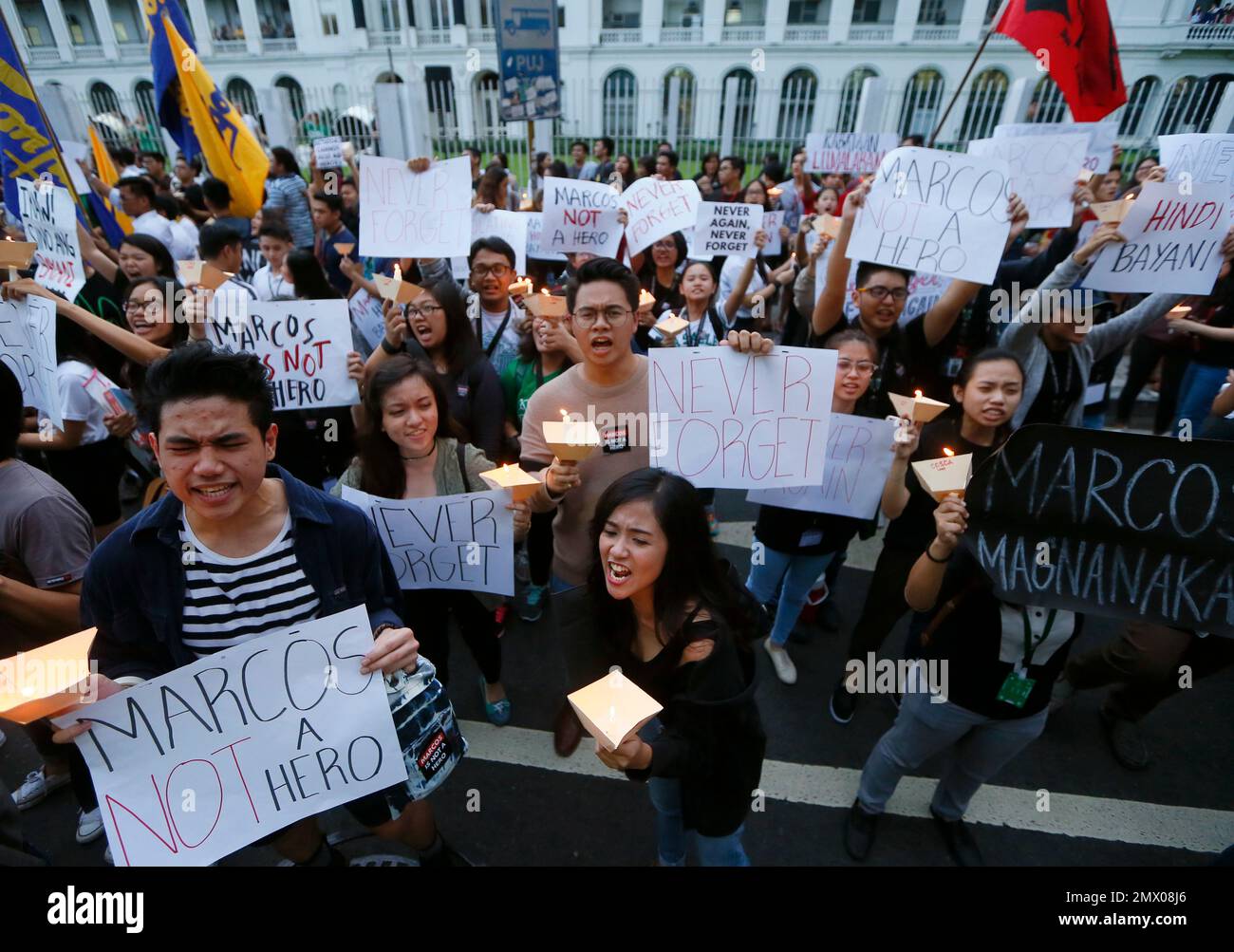 Students shout slogans during a "noise barrage" protest against last ...