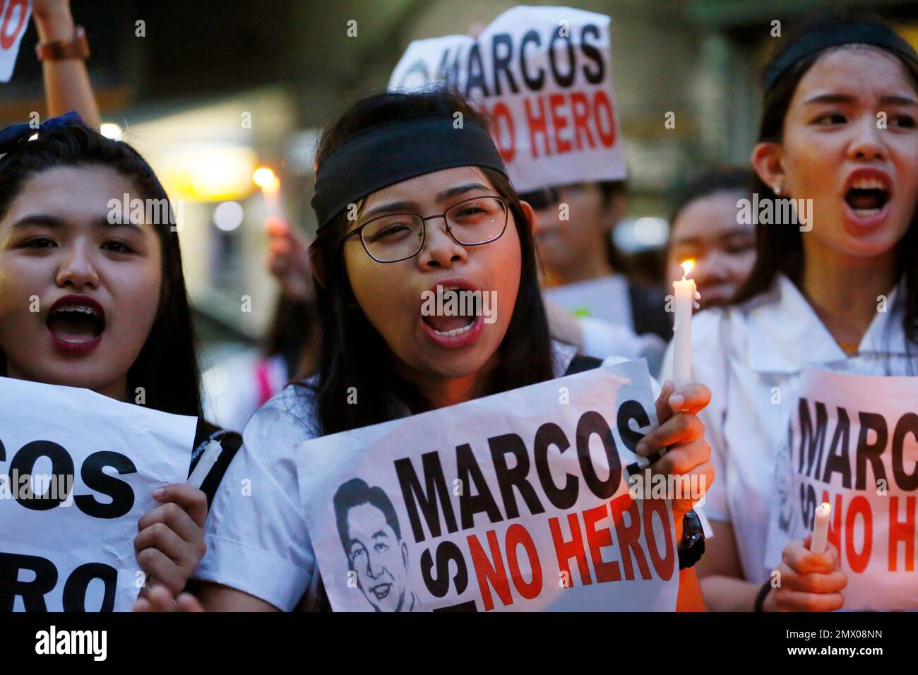 Students shout slogans during a protest against last week's burial of ...